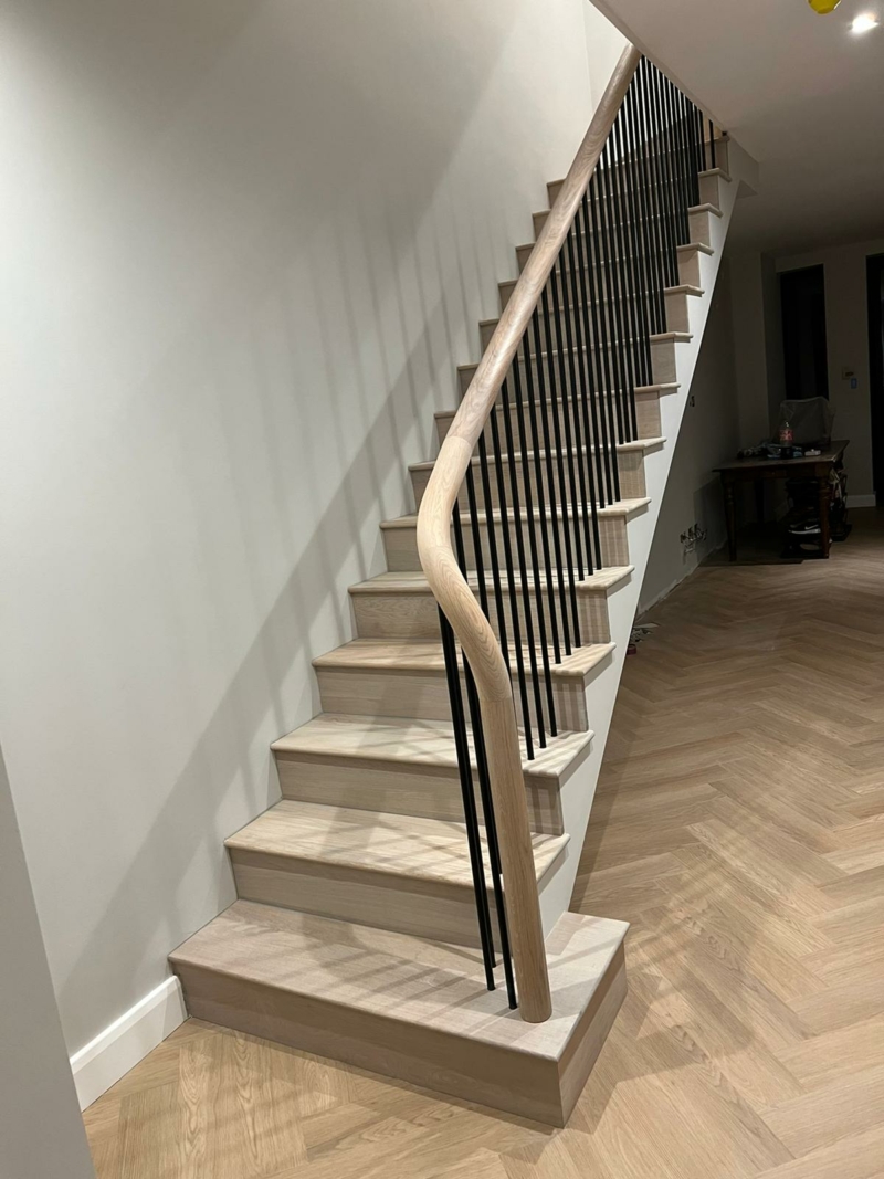 Closed Tread Staircase with Metal Spindles and Light Brown Oak Handrail ...