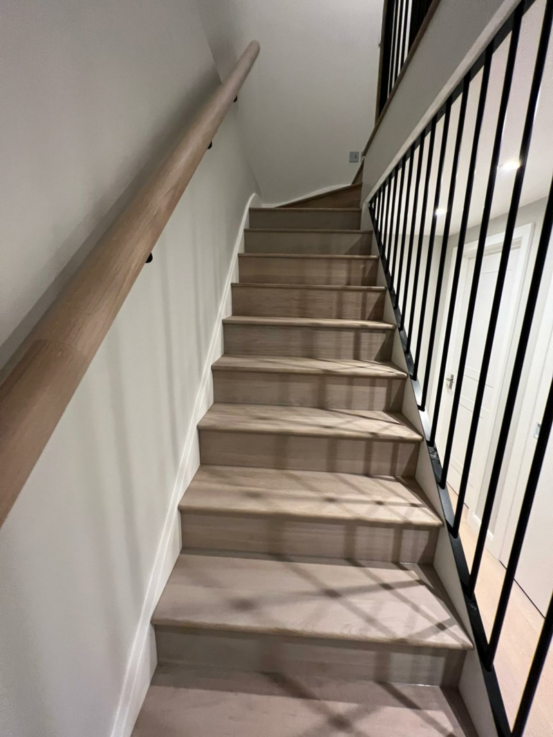 Closed Tread Staircase with Metal Spindles and Light Brown Oak Handrail ...