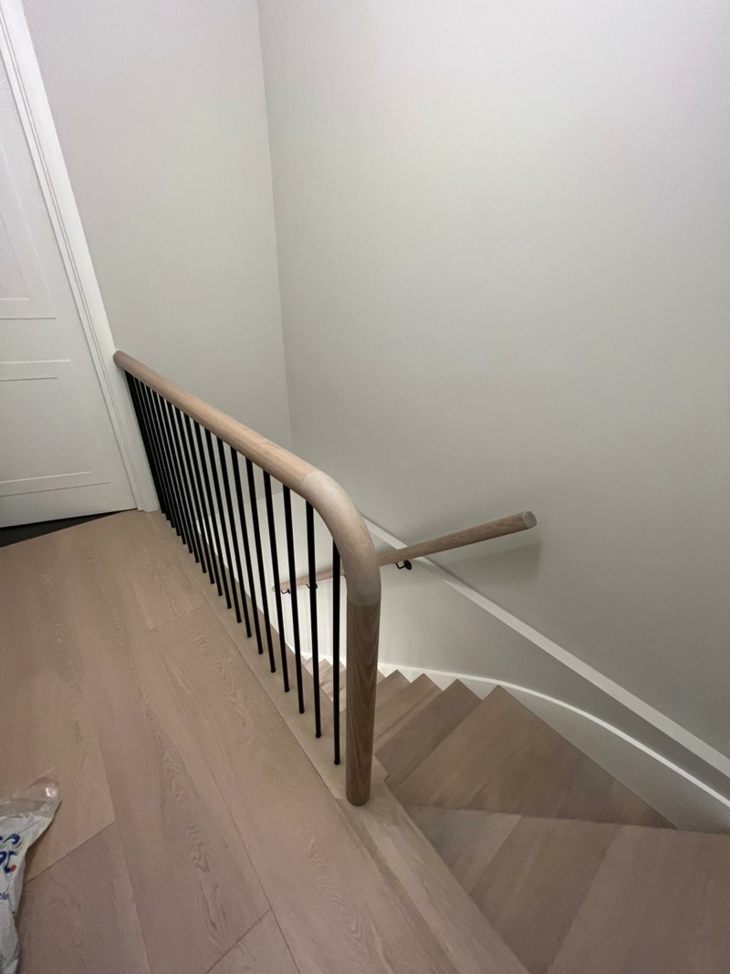 Closed Tread Staircase with Metal Spindles and Light Brown Oak Handrail ...