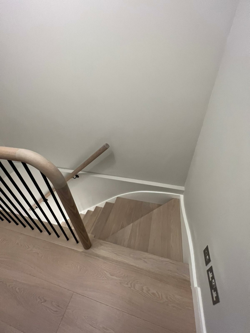 Closed Tread Staircase with Metal Spindles and Light Brown Oak Handrail ...