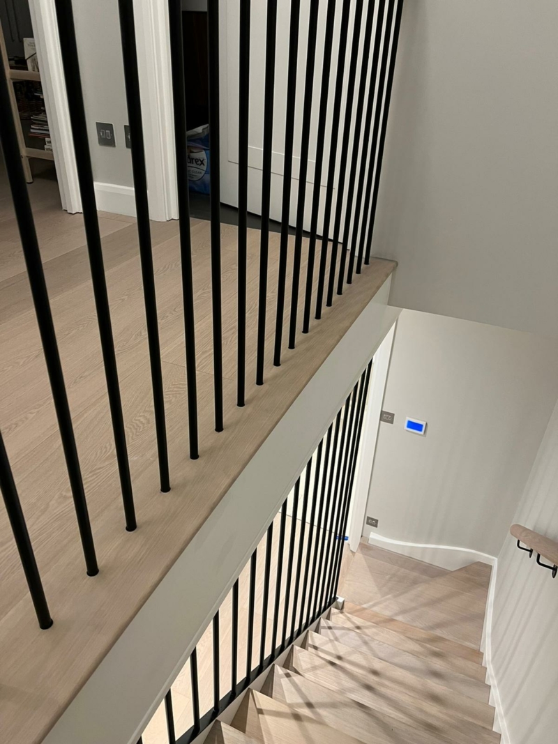 Closed Tread Staircase with Metal Spindles and Light Brown Oak Handrail ...