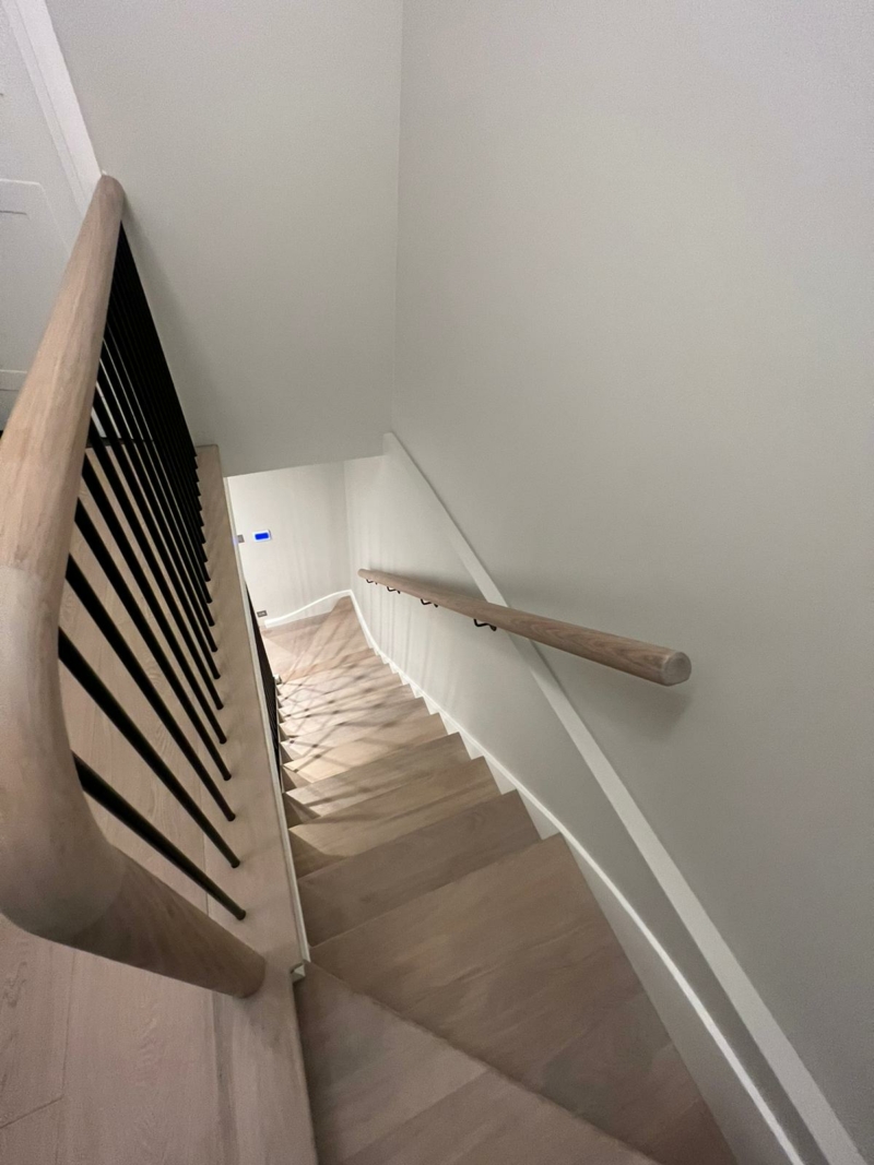 Closed Tread Staircase with Metal Spindles and Light Brown Oak Handrail ...