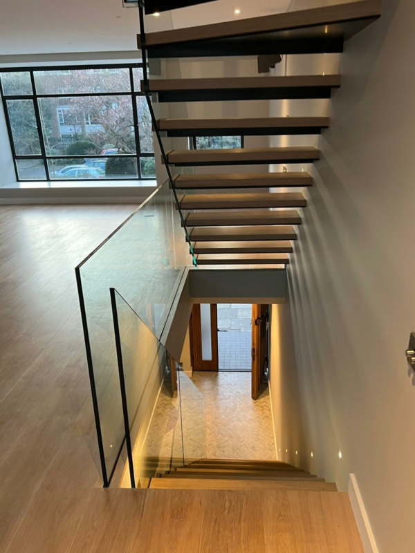 Floating Staircase with Frameless Glass Balustrade and Light Brown Oak ...
